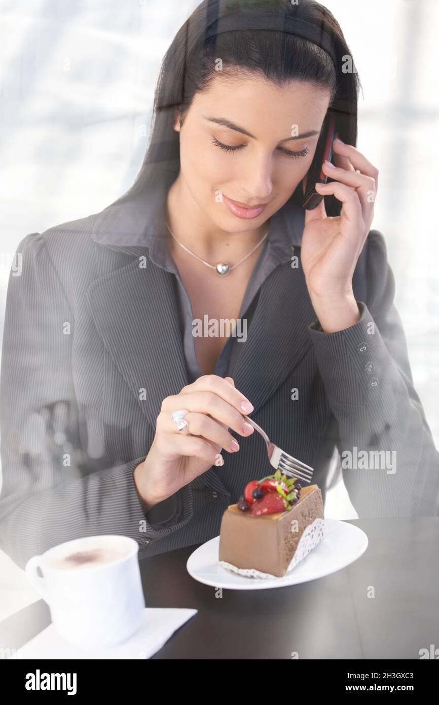 Office worker on phone call in cafe Stock Photo - Alamy