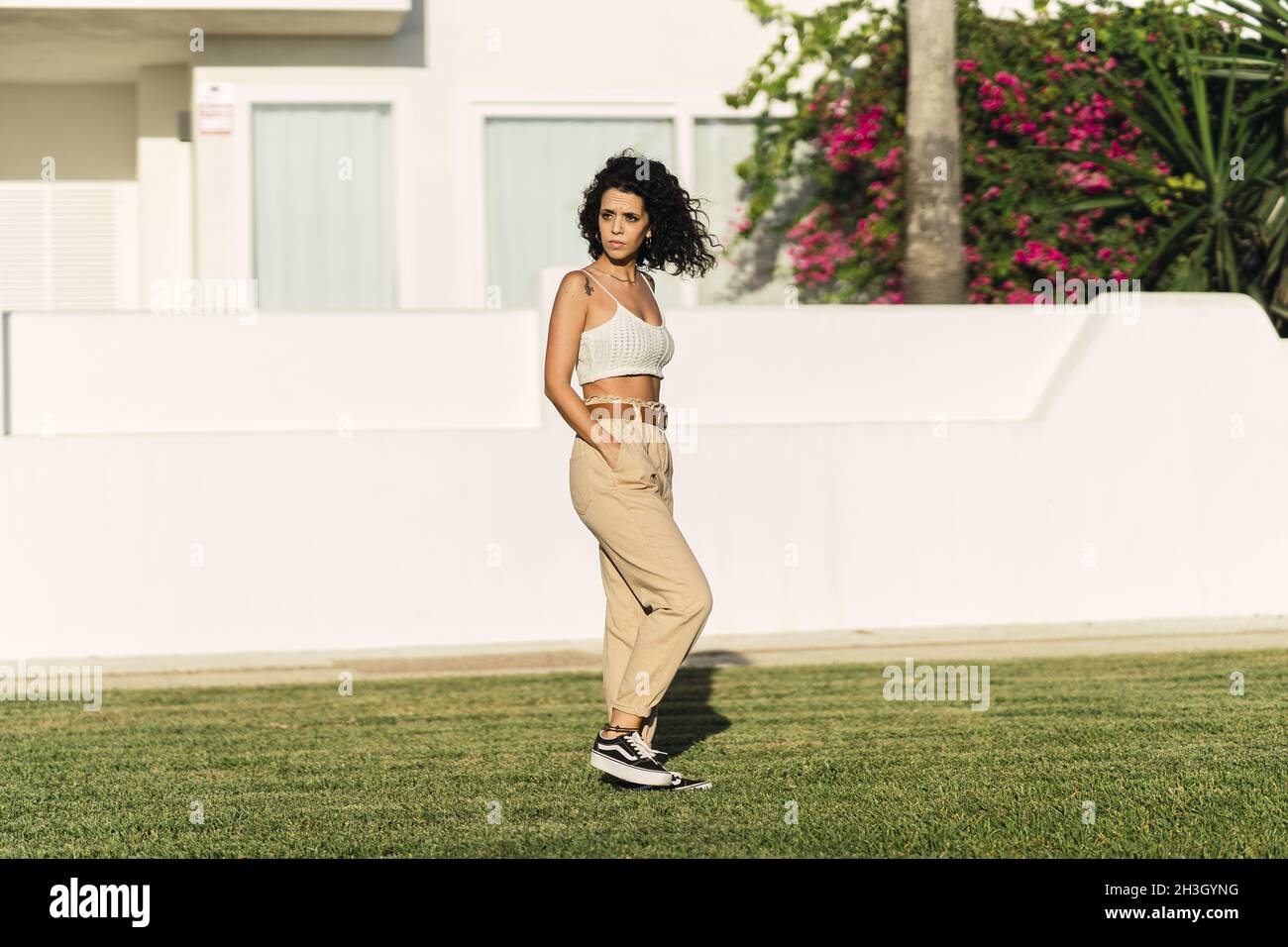 Spanish female posing in the street Stock Photo - Alamy