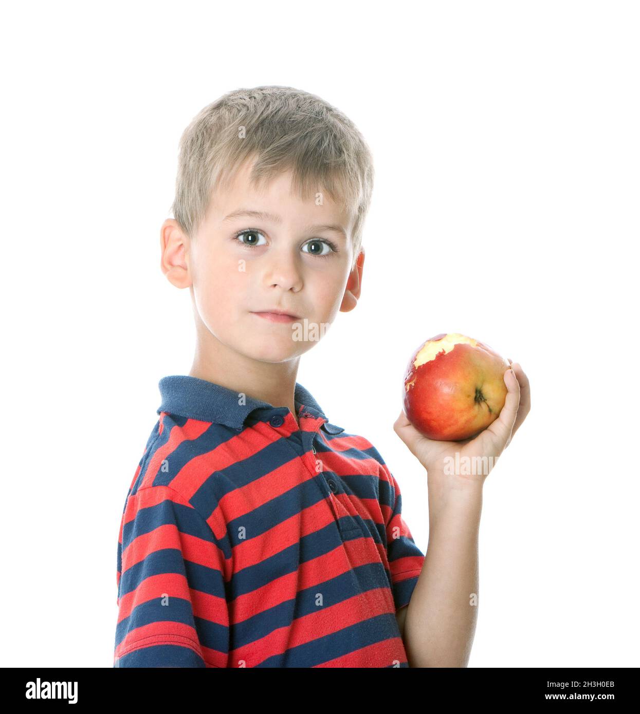 Boy holding an apple isolated on white background Stock Photo - Alamy