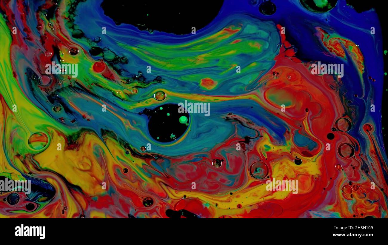 Beautiful colorful colors on water. Footage. Thick multicolored colors ...