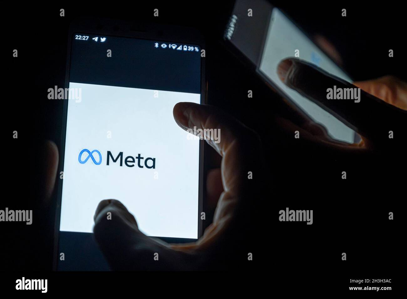 In this photo illustration the new Facebook Meta logo is seen on a ...