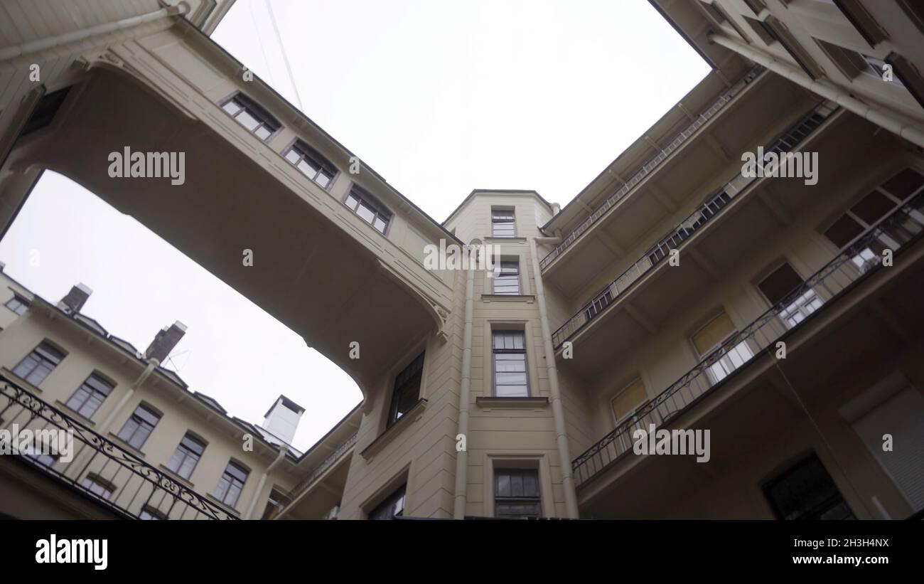 Bottom view of beautiful courtyard of residential building. Journey ...