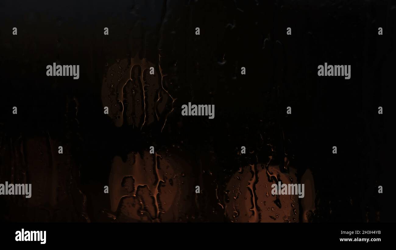 Close-up of drops on glass background of bokeh lights. Concept. Through ...