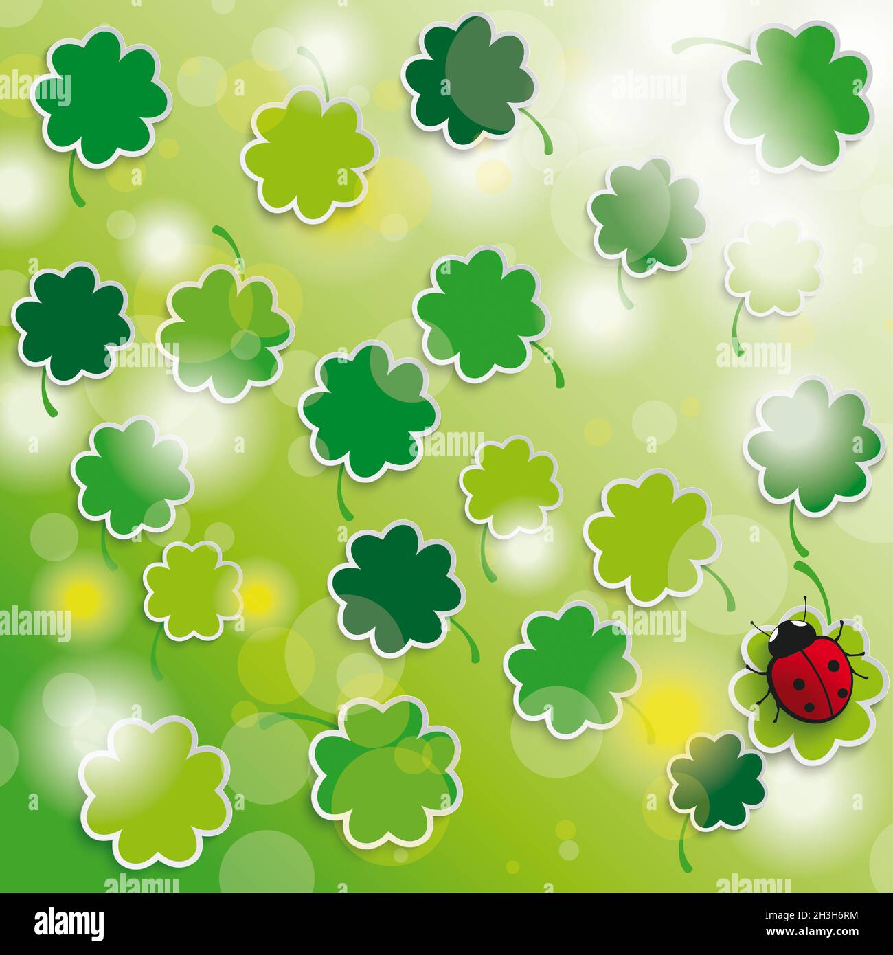 Spring card shamrock sunlights Stock Photo - Alamy