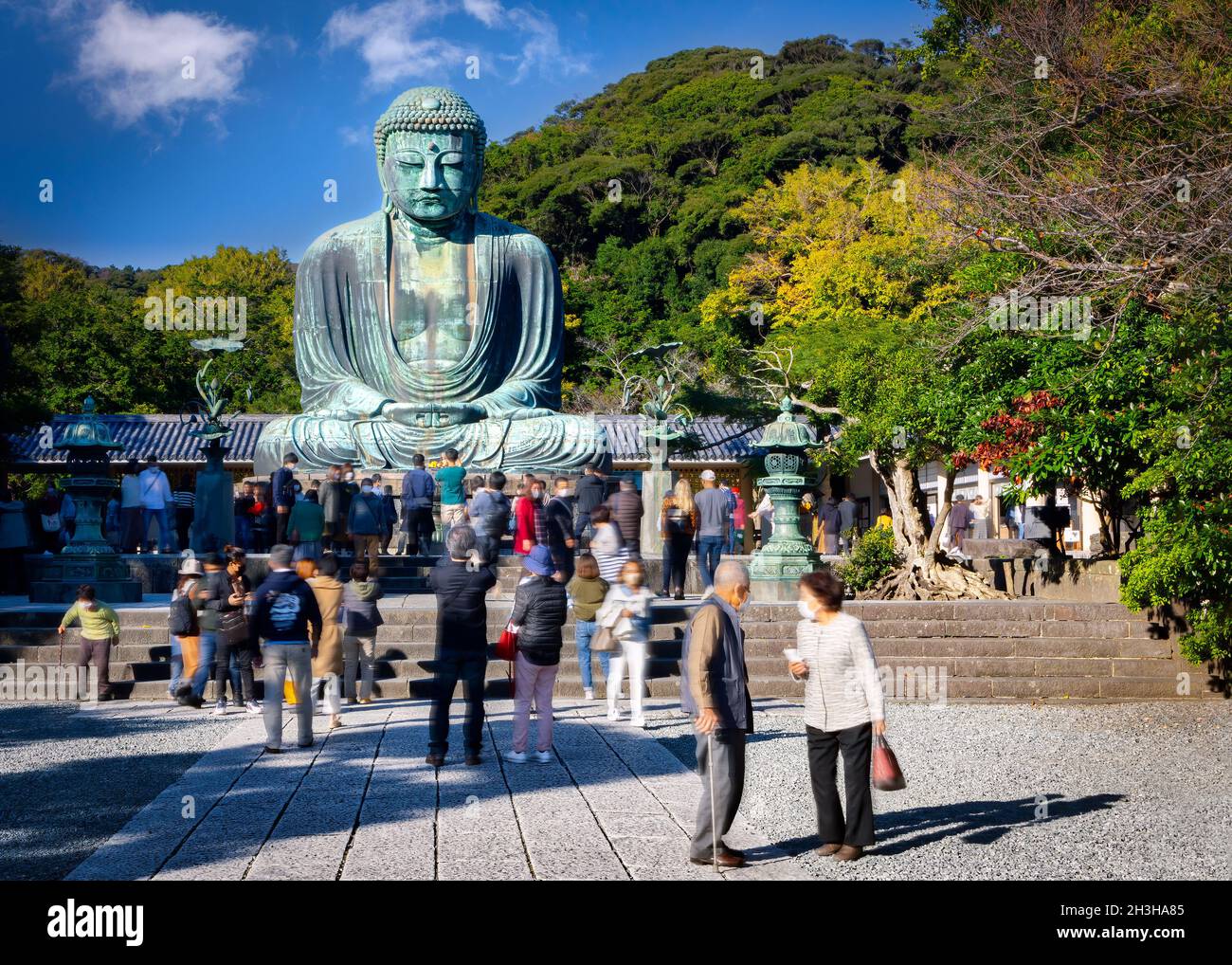 Tourists gather at the Great Buddha, or Kamakura Daibutsu, the 43 foot ...