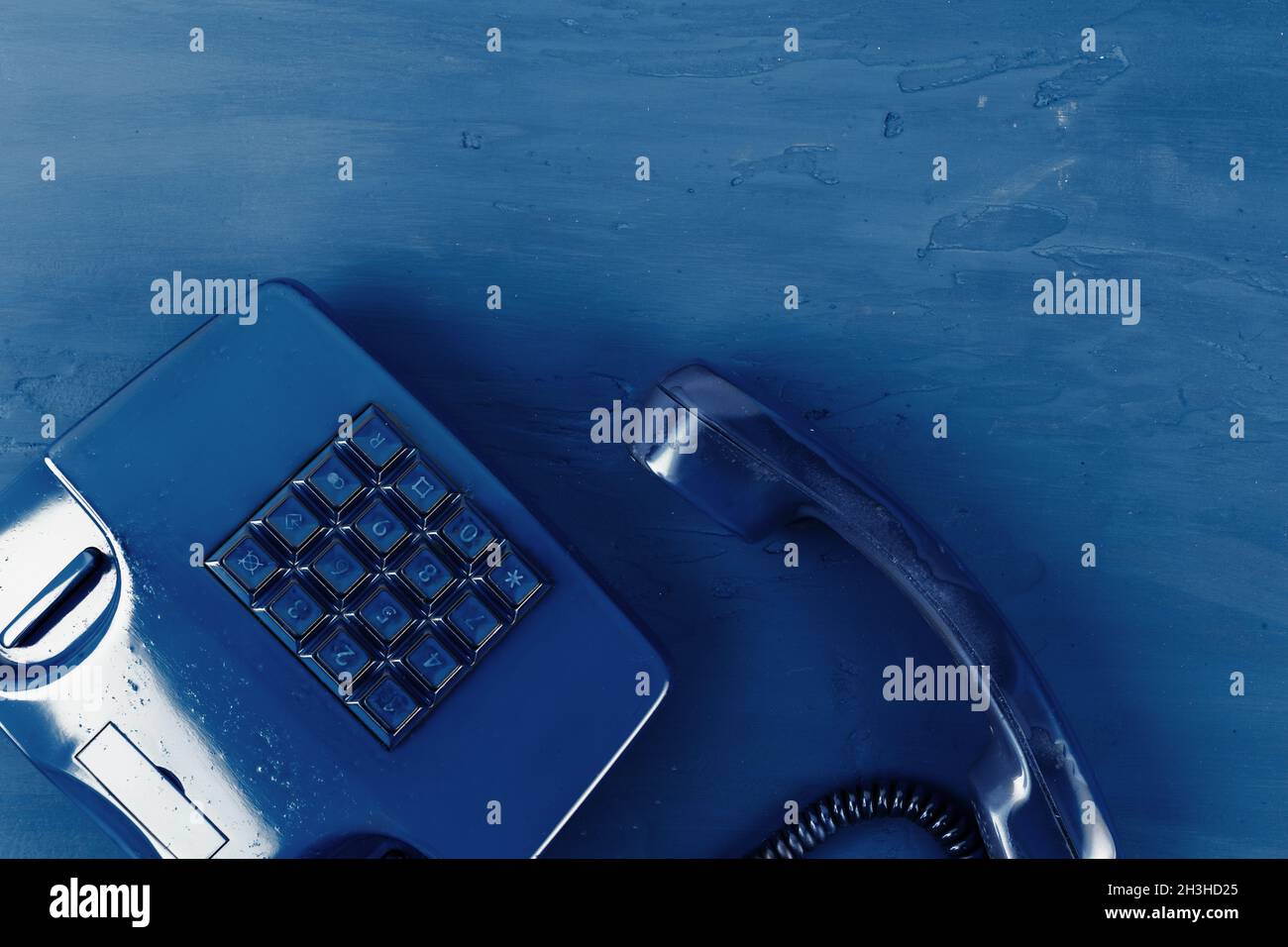 Retro telephone of blue color on classic blue background Stock Photo ...