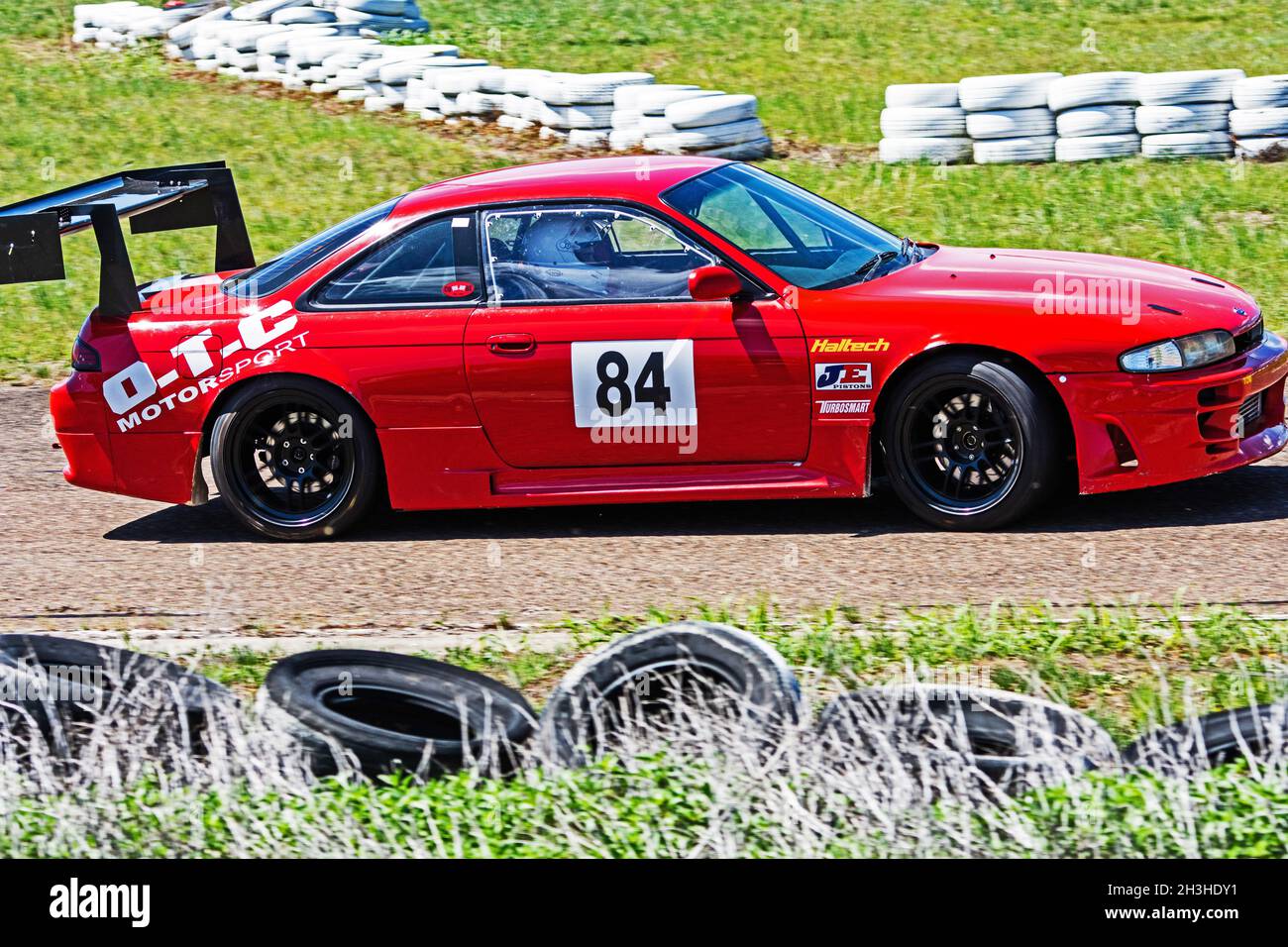 Red coupe on race track,Tamworth Australia Stock Photo - Alamy