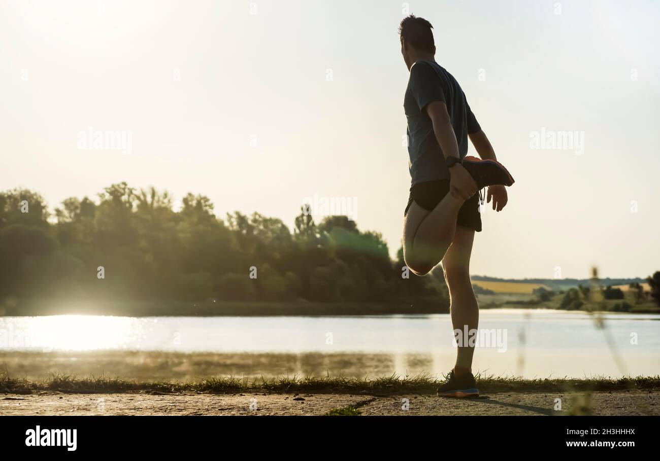 The athlete warms up before running Stock Photo - Alamy