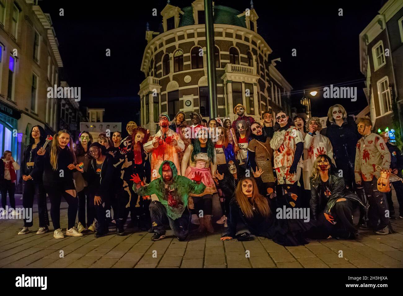 The zombies are seen posing for group photos during the walk.Last two ...