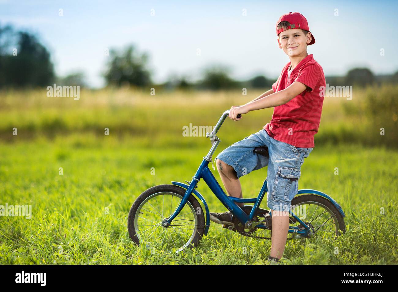 Boy riding bicycle hi-res stock photography and images - Alamy