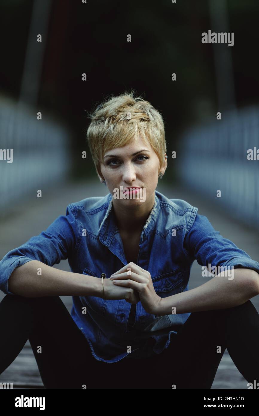 Sitting with legs apart hi-res stock photography and images - Alamy