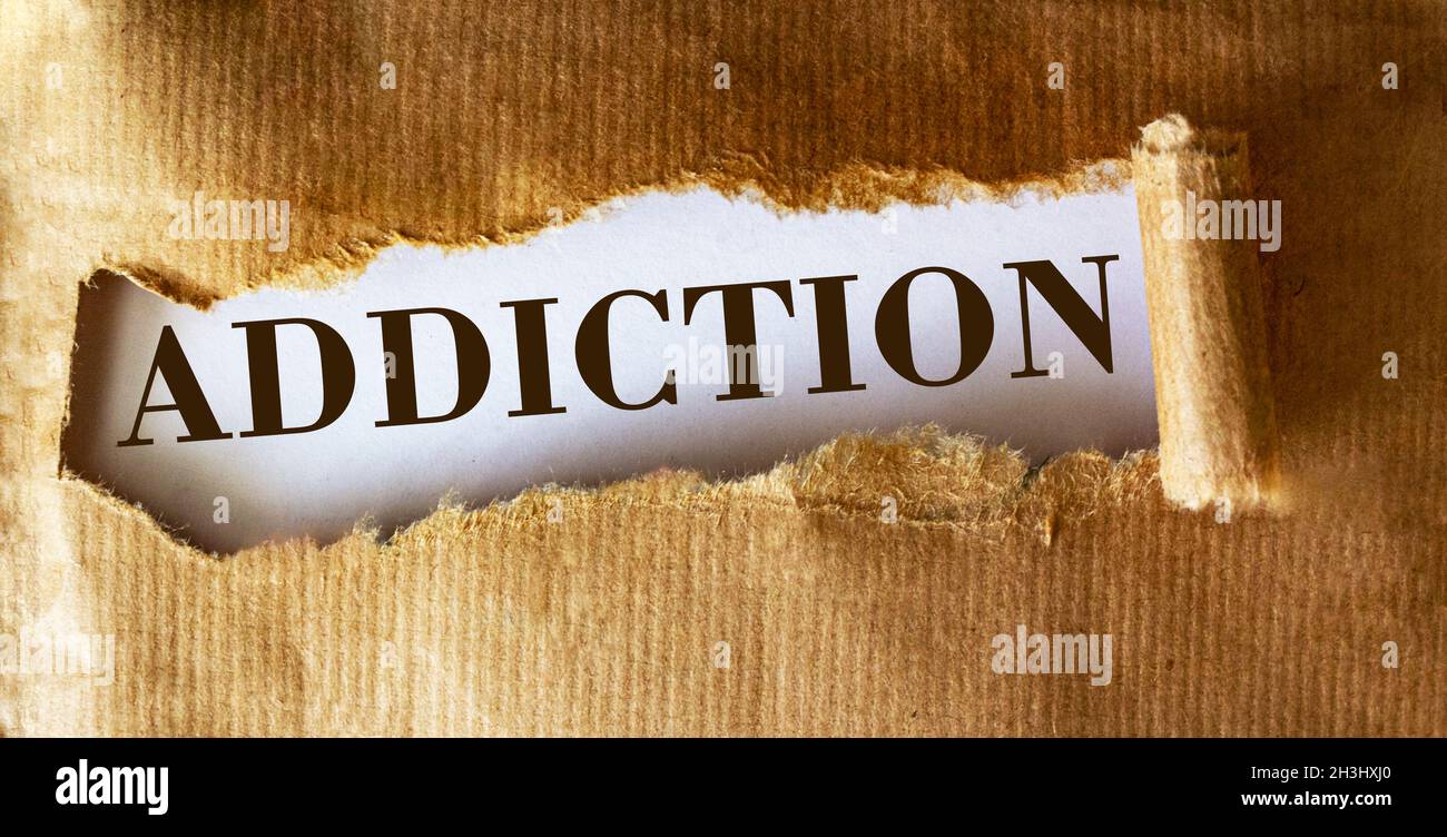 The word Addiction is written underneath brown torn paper Stock Photo ...