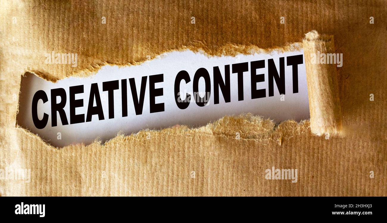 Text Creative content is written on torn brown paper Stock Photo - Alamy