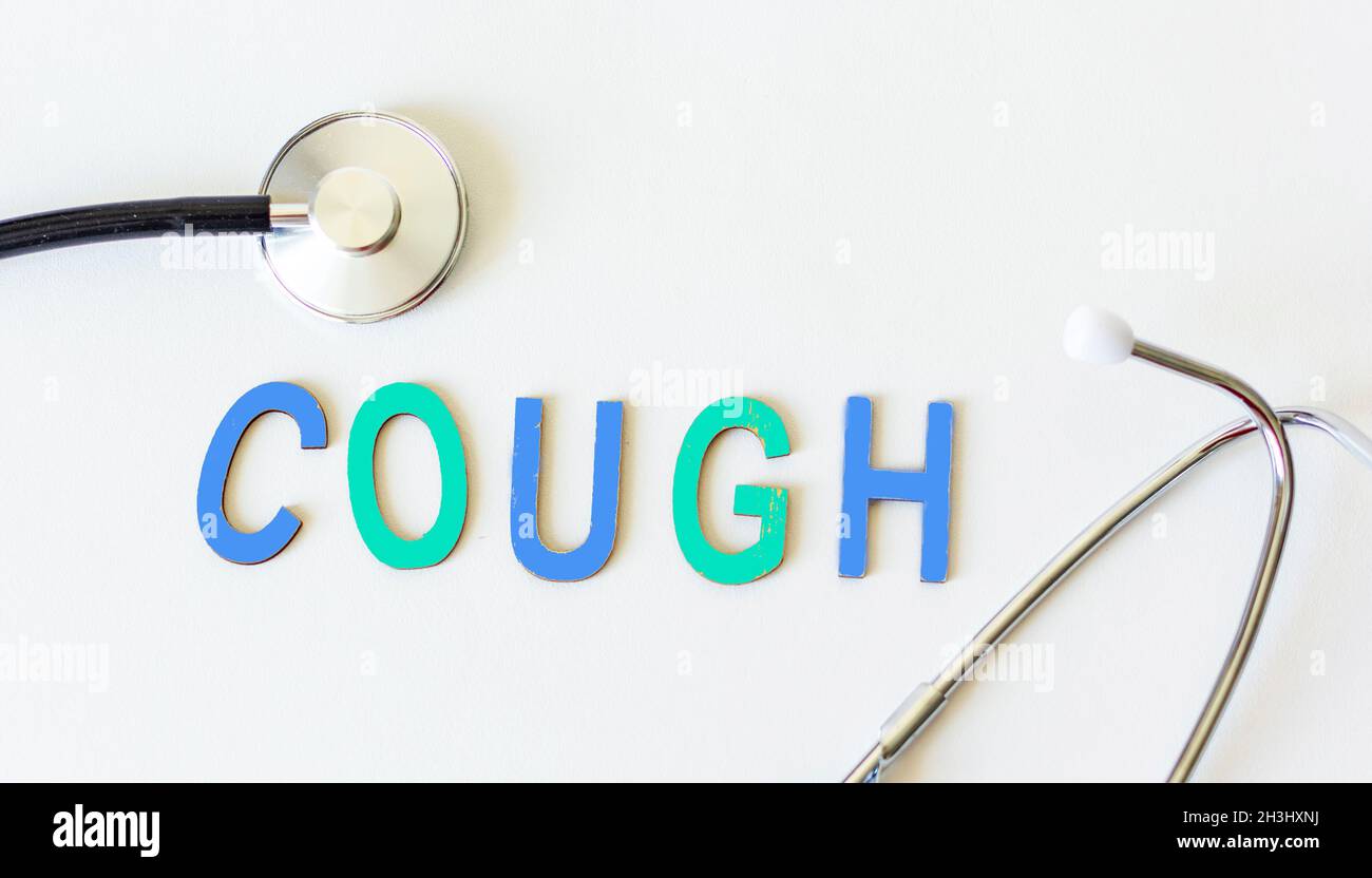 The word cough in wooden letters and with a stethoscope next to it on a ...