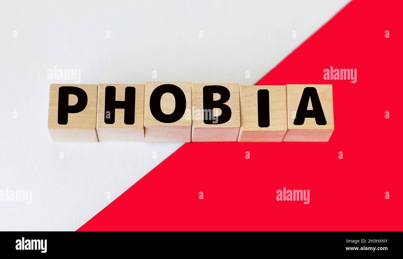 Wooden blocks with the text: Phobia on a white and red background Stock ...