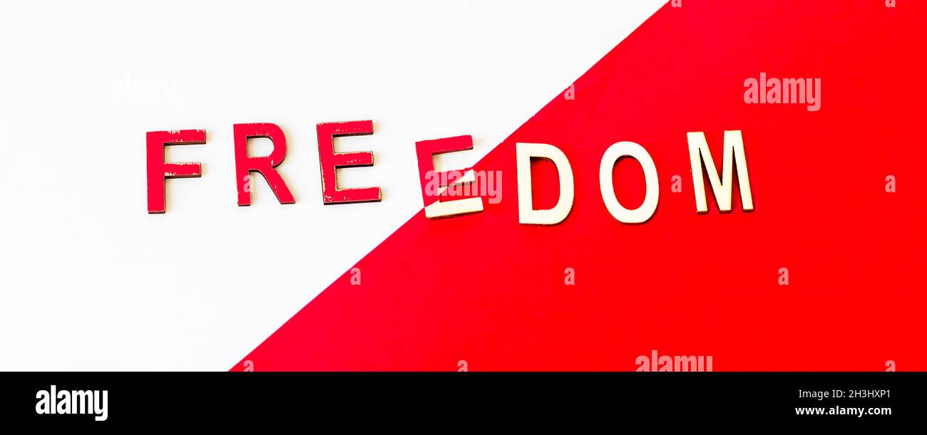 The word FREEDOM is written on a red and white background Stock Photo ...