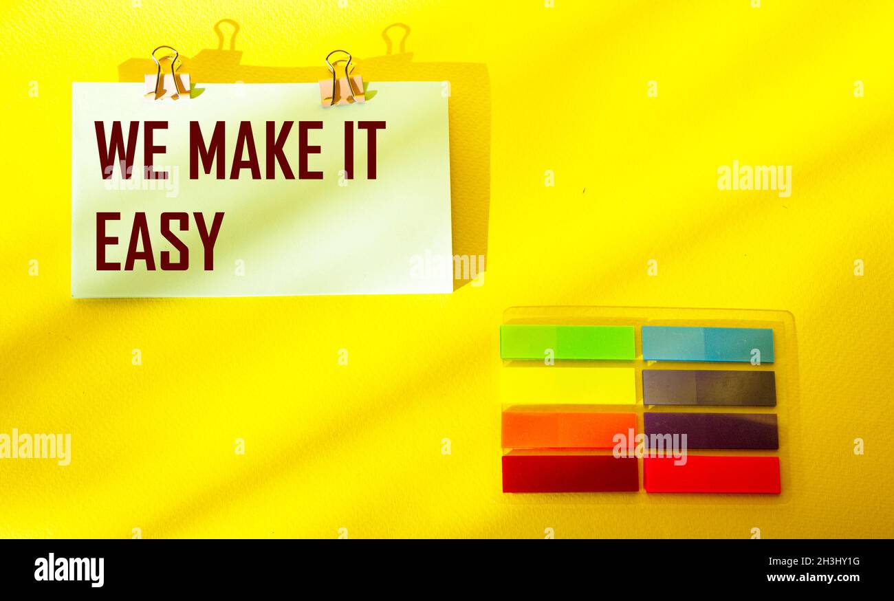 We make it easy The text is written on a sticker and a yellow ...