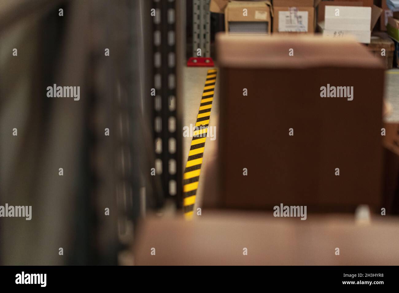 Cardboard packaging box in industrial building rack Stock Photo - Alamy