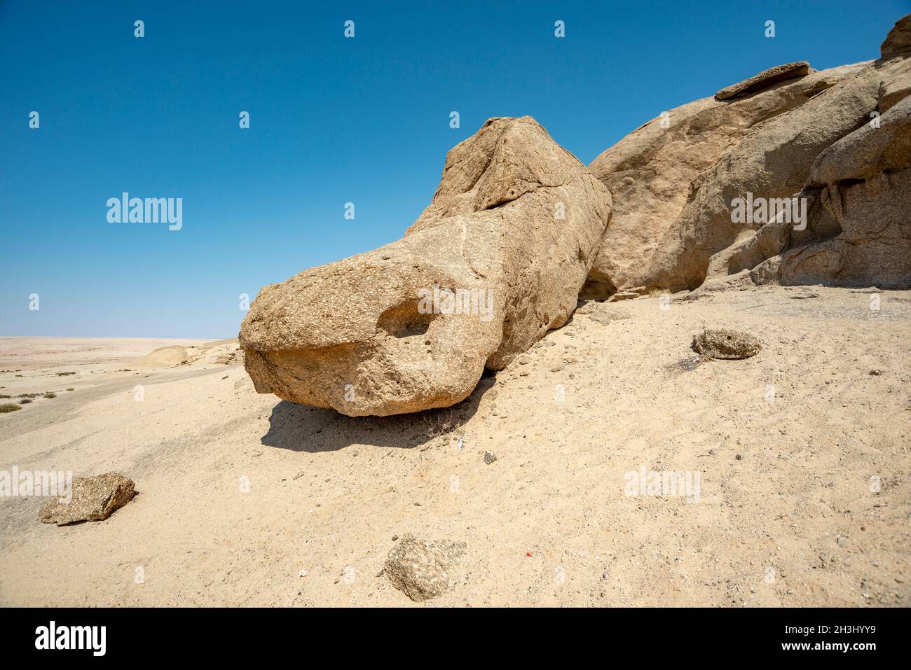 scenic volcanic rock formation among sand desert in Namibia Stock Photo ...