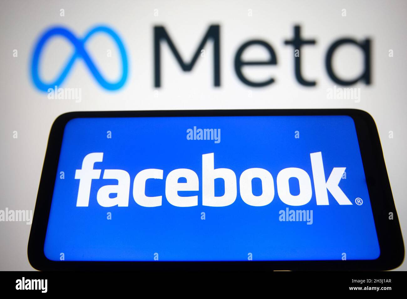 In this photo illustration a Facebook logo is seen on a smartphone ...