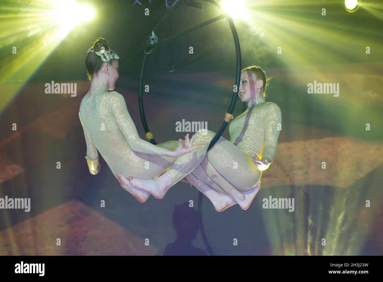 Circus actress acrobat performance. Two girls perform acrobatic ...