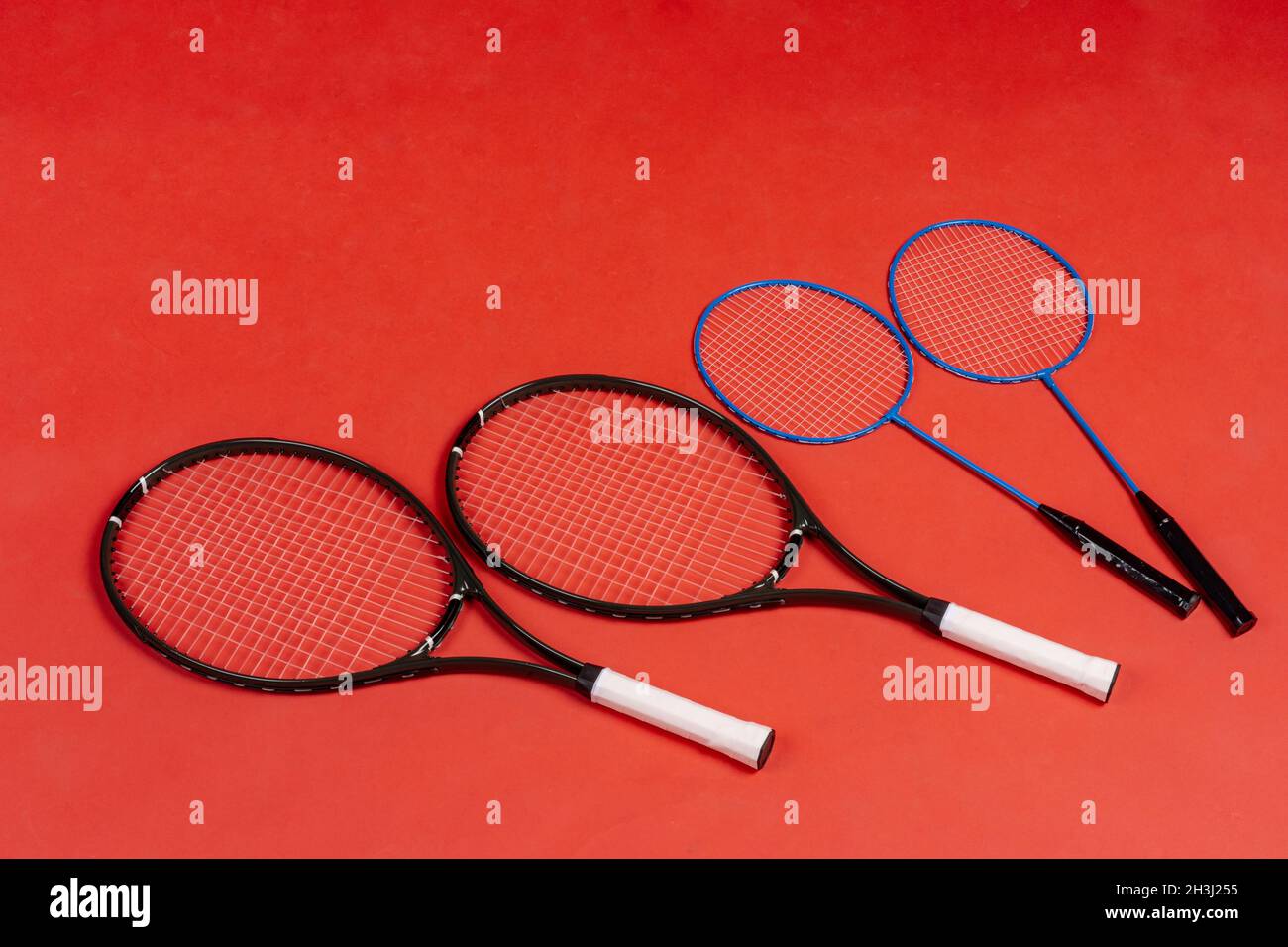 Four rackets. Rackets for tennis and for badminton Stock Photo - Alamy
