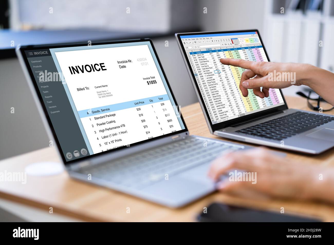 Businesswoman Looking At Invoice On Computer Screen In The Office Stock ...