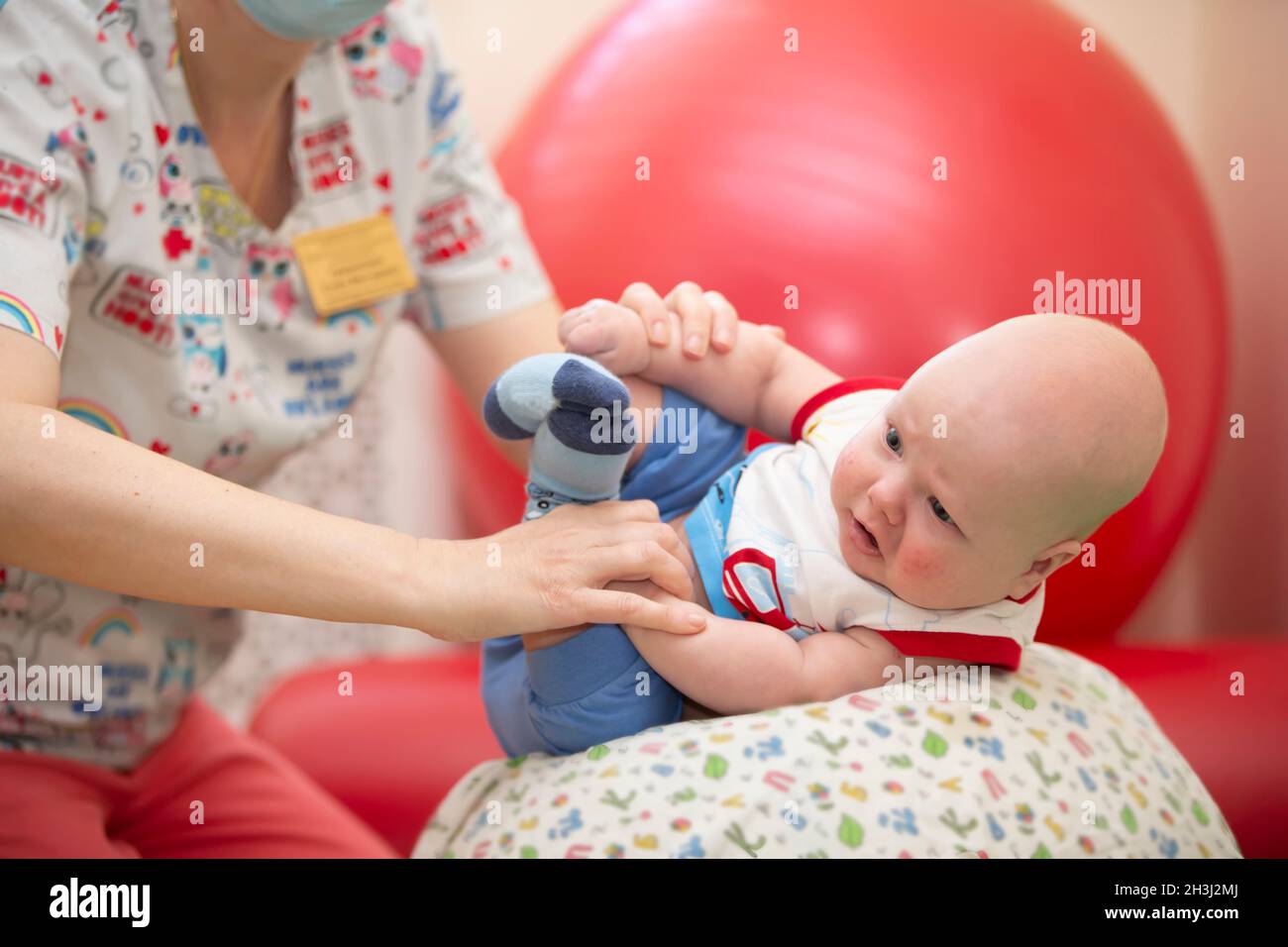 Mother massaging newborn baby hi-res stock photography and images - Alamy