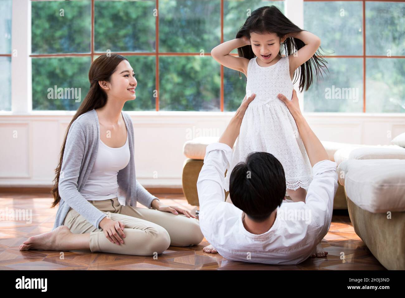 Warm and loving family of three Stock Photo - Alamy