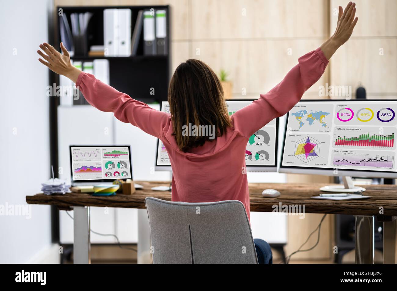 Business Woman Doing Stretch Exercise At Office Desk Stock Photo - Alamy