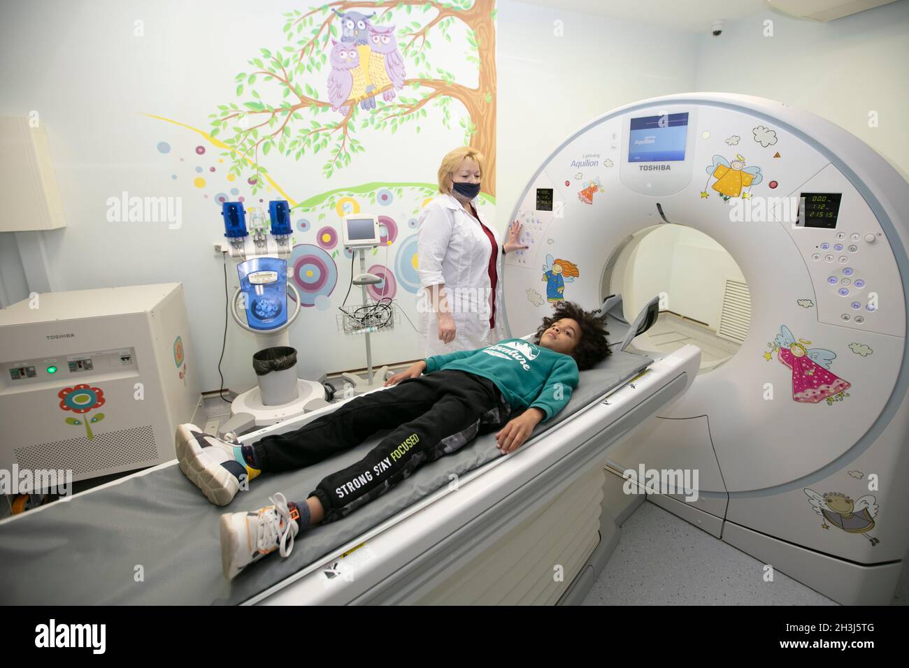 Belarus, city of Gomil, May 31, 2021. A child lies in an MRI machine. A ...