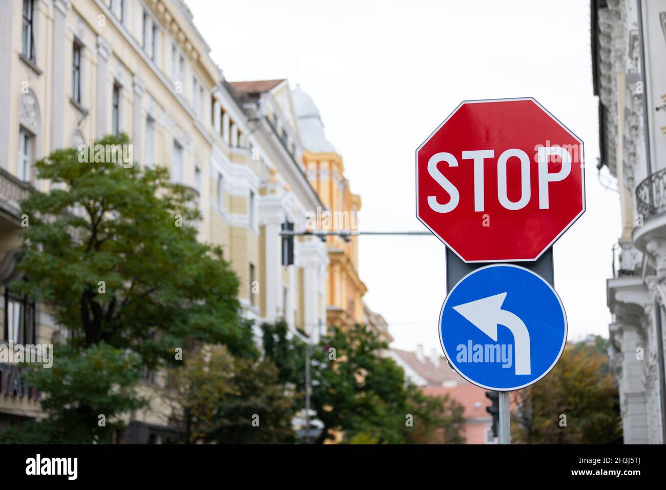 Close up picture of traffic signs in the city - stop and mandatory to ...