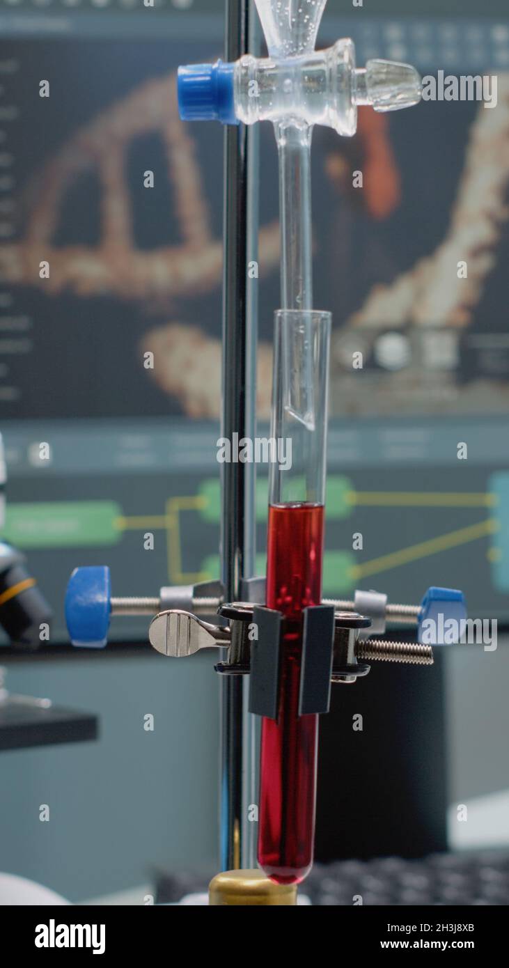 Close up of test tube and pipe for mixing solutions in laboratory on ...