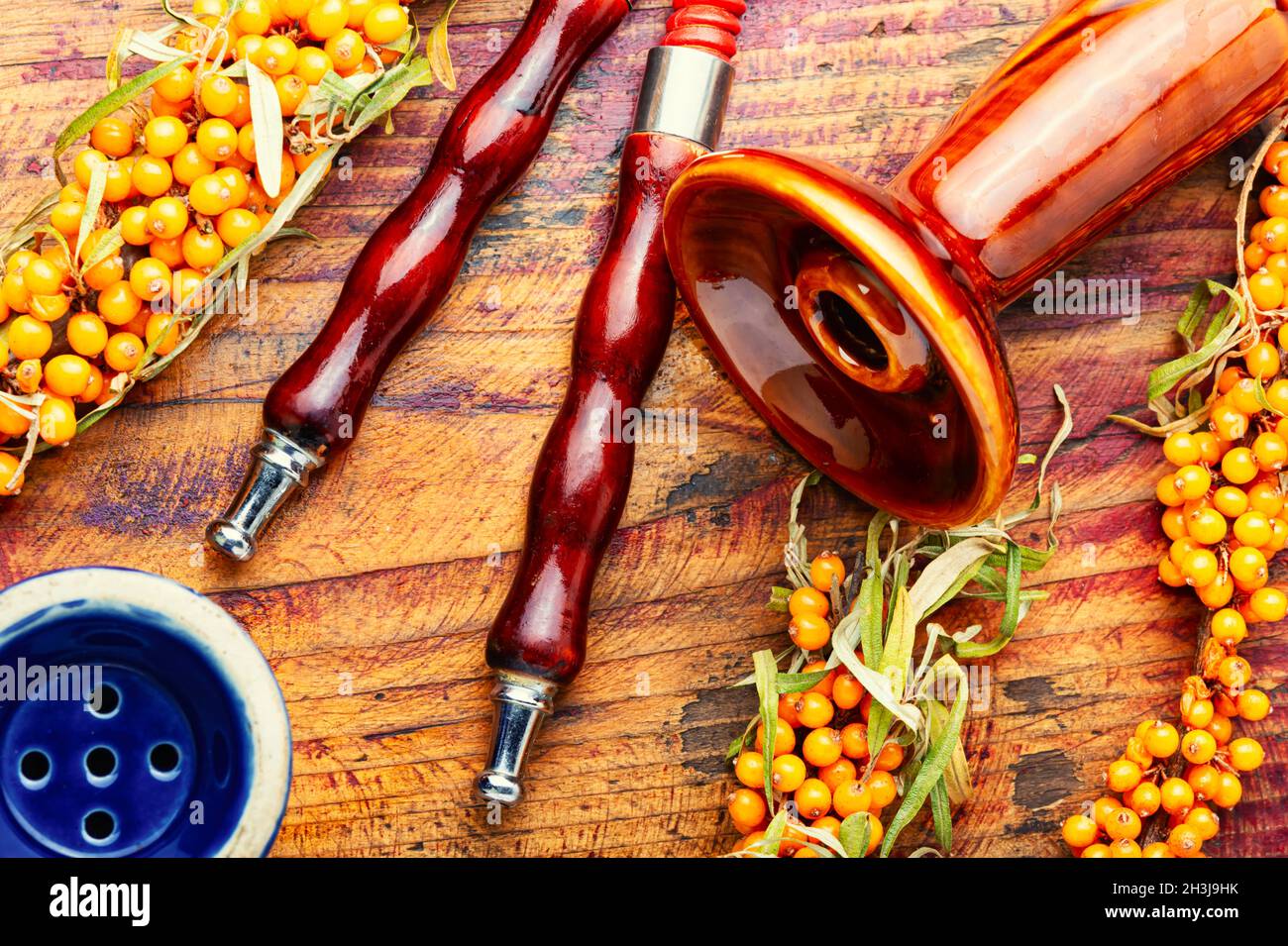 Fresh light shisha of autumn berry.Smoking hookah with sea buckthorn ...