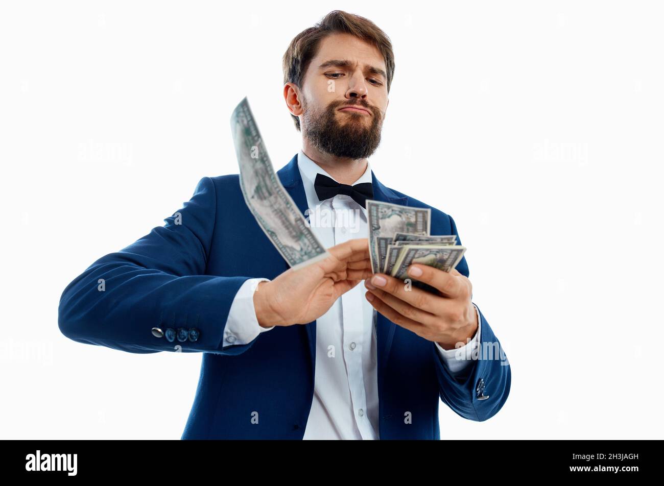 rich man money in hand isolated background Stock Photo - Alamy