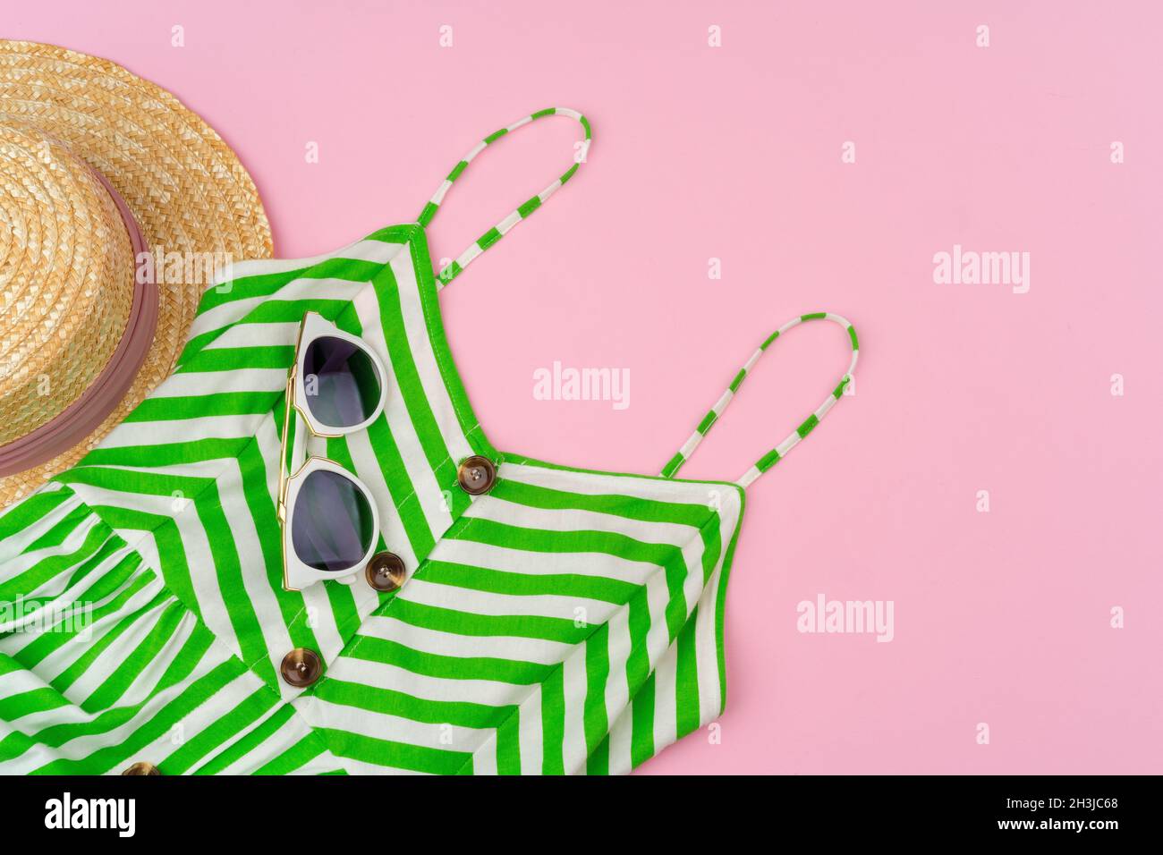 Set of summer clothes for woman on pink background Stock Photo - Alamy