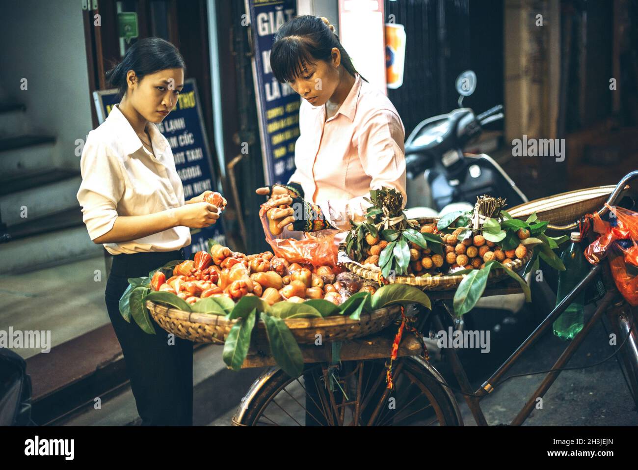 Hanoi, Vietnam - May 2, 2015: Vietnamese street market lady seller, on ...