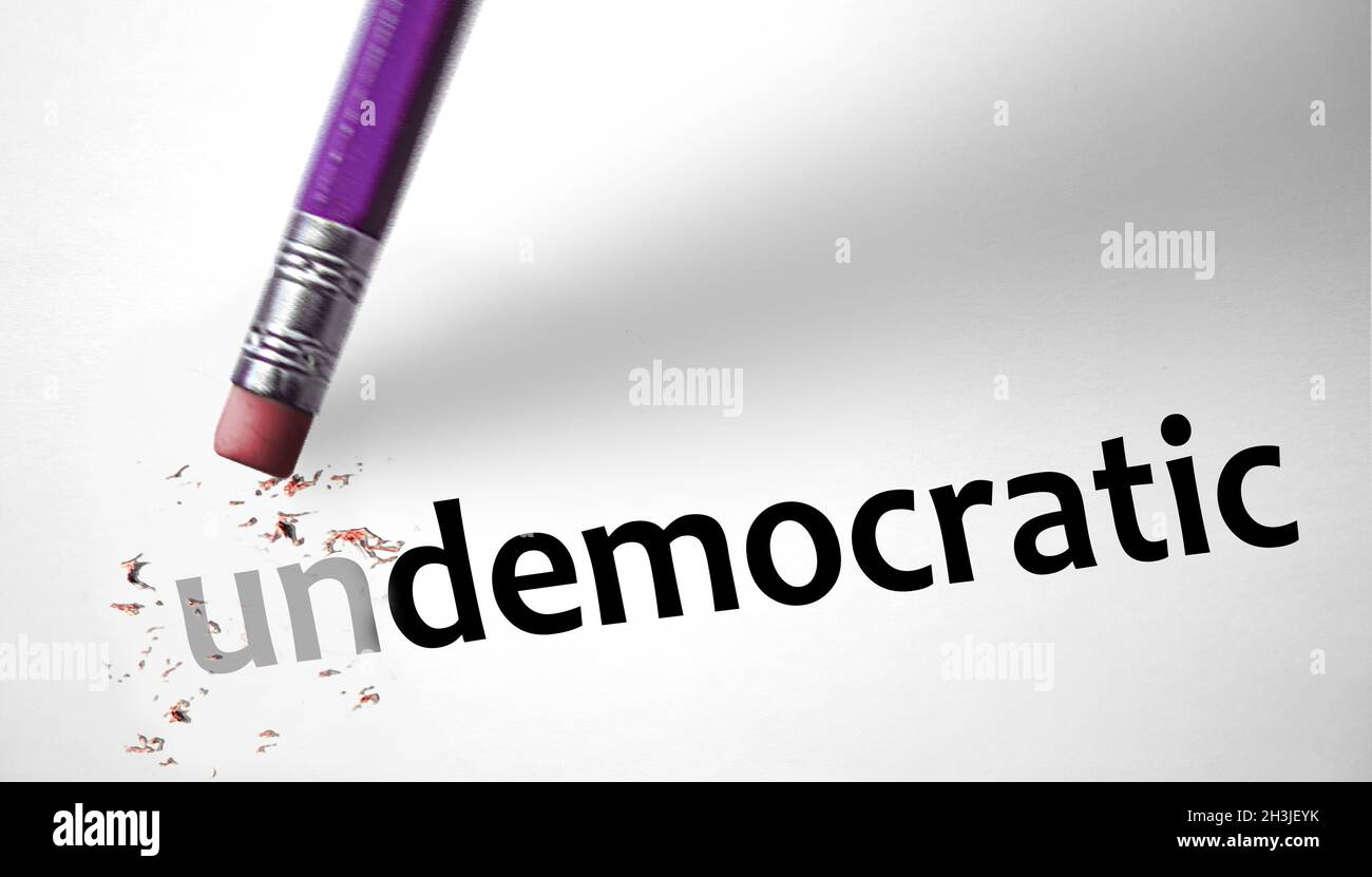 Eraser changing the word Undemocratic for Democratic Stock Photo - Alamy