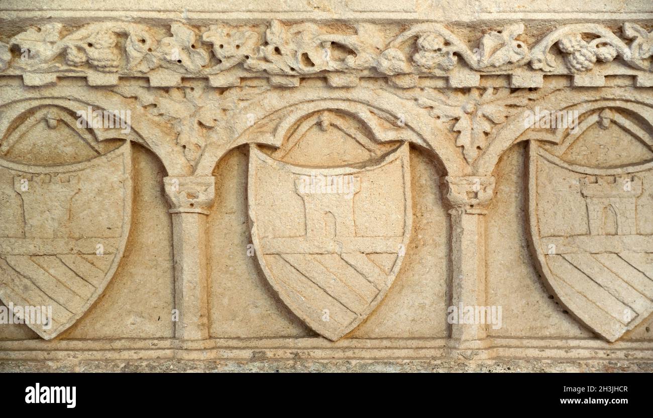 Medieval shield in stone wall texture backgrouund Stock Photo - Alamy