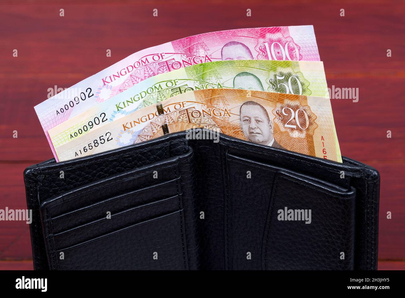 Tongan money - paʻanga in the black wallet Stock Photo - Alamy