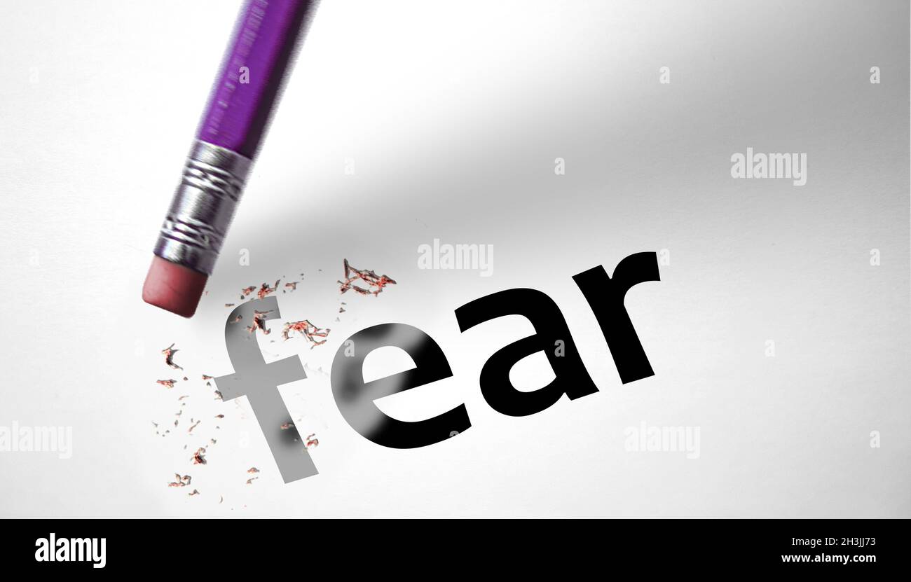 Eraser deleting the word Fear Stock Photo - Alamy