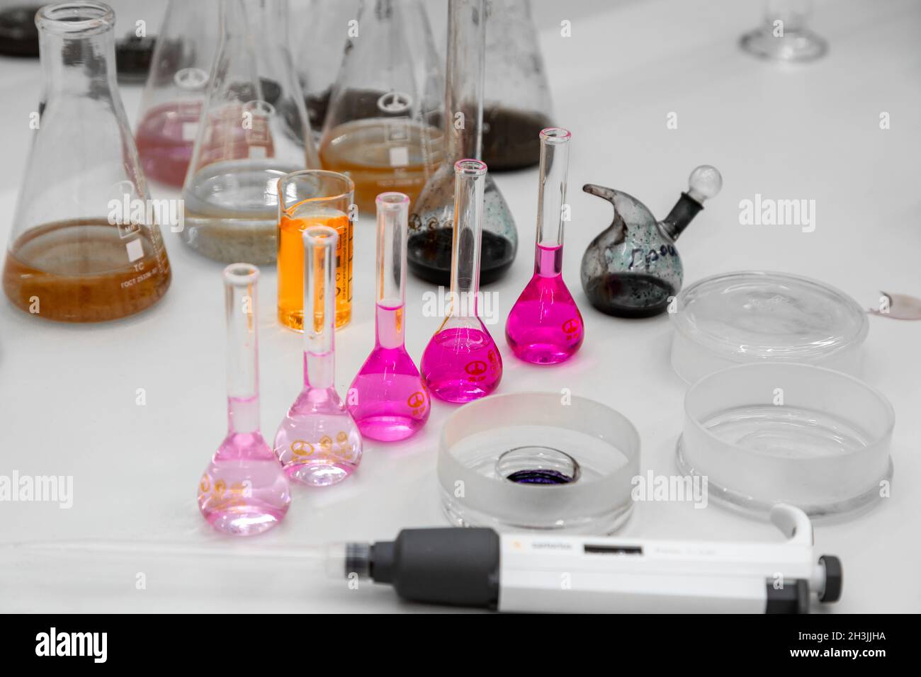 Composition of laboratory material with colored liquids in realistic ...