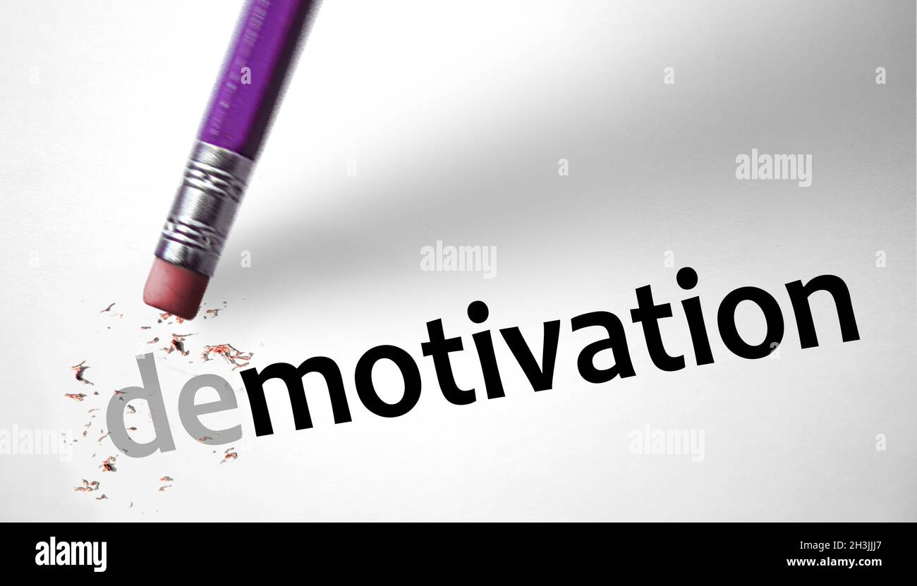 Eraser changing the word Demotivation for Motivation Stock Photo - Alamy