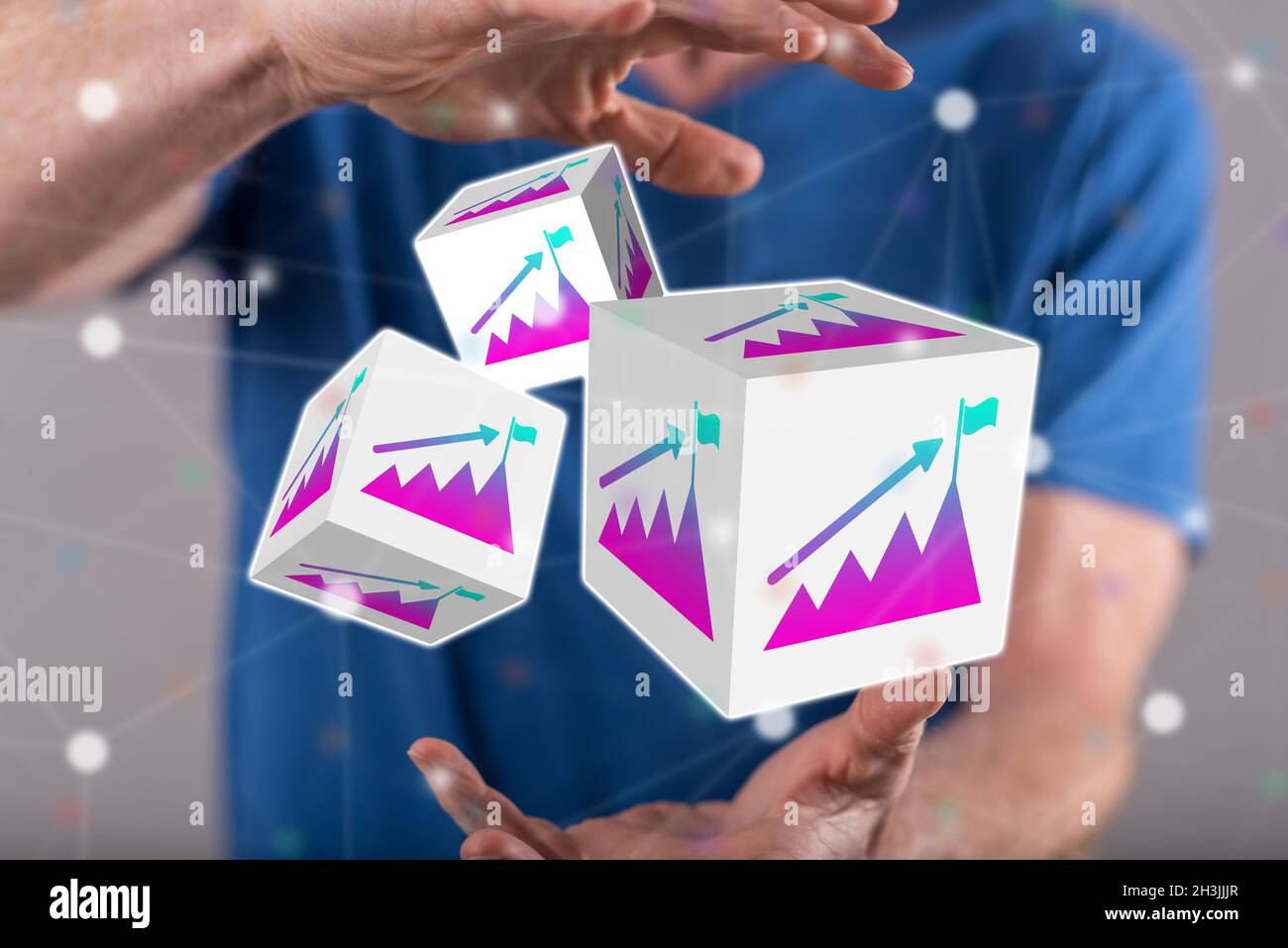 Goals concept between hands of a man in background Stock Photo - Alamy