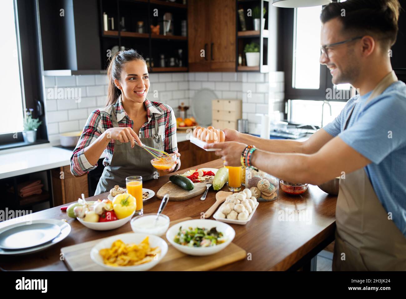 People Cooking Food In The Kitchen
