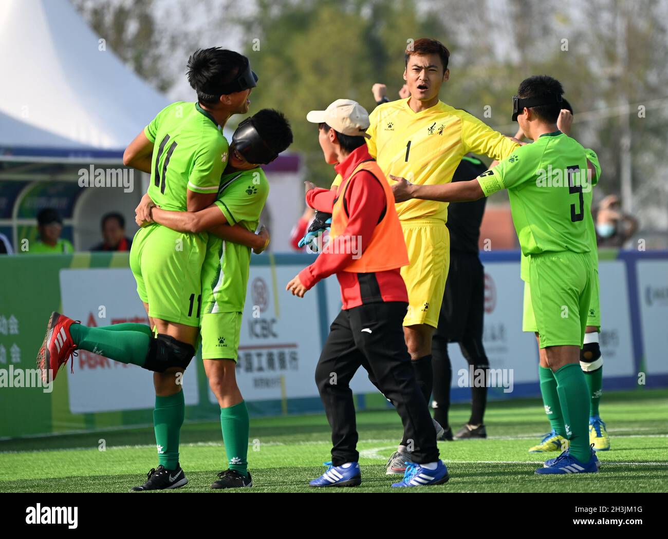 Xi'an, China. 24th Oct, 2021. Zhui Ruiming (1st L) celebrates with his ...