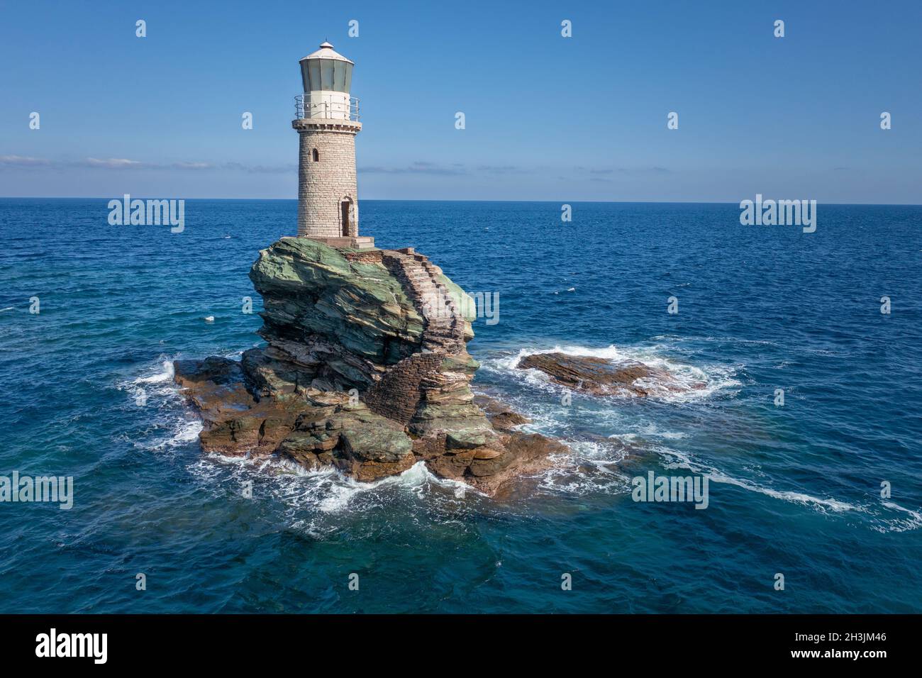 Tourlitis lighthouse off the coast of andros island, greece hi-res ...
