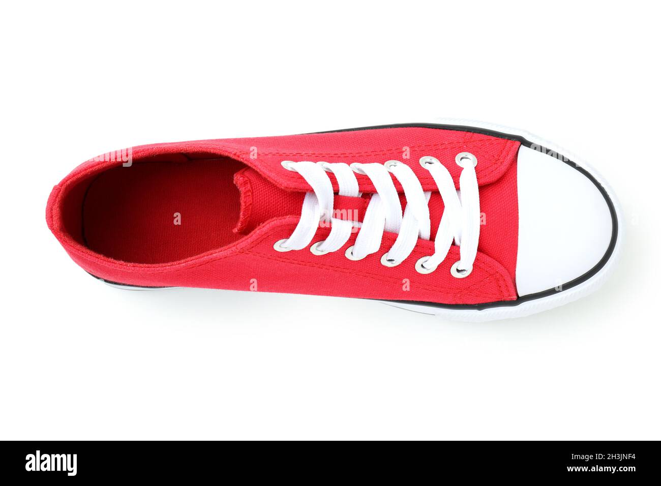 One red sneaker isolated on white background Stock Photo - Alamy