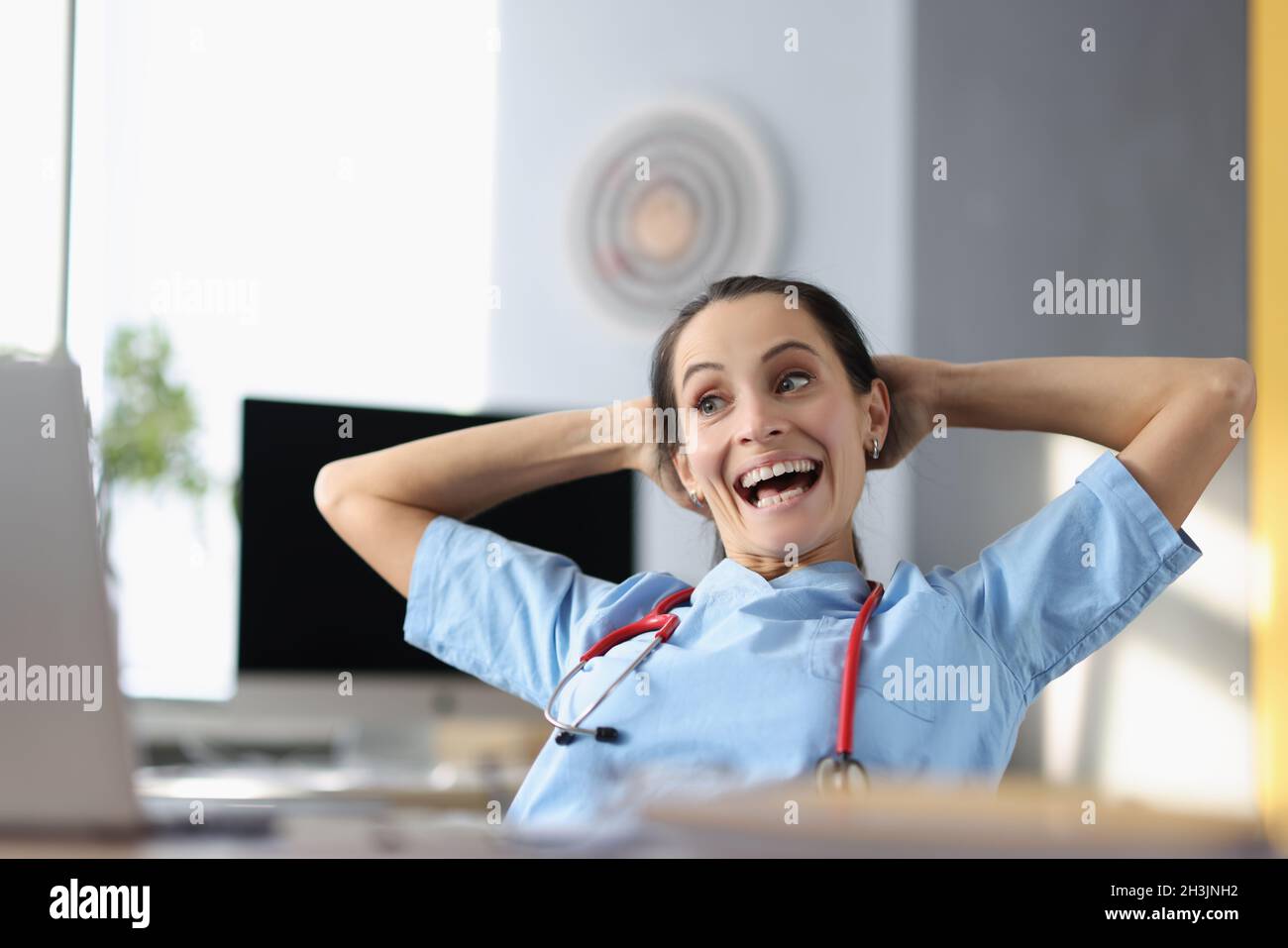 Cheerful doctor chilling at work Stock Photo - Alamy