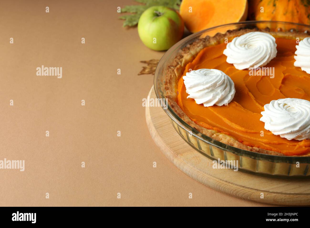 Concept of tasty food with pumpkin pie on beige background Stock Photo ...